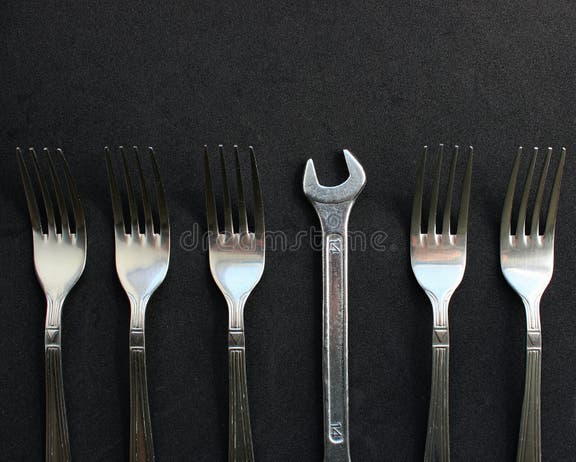 Steel Hex Spanner in a Row of Metal Table Forks Stock Image - Image of ...