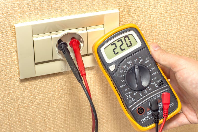 Metering Socket Voltage with Digital Multimeter. Stock Image - Image of ...