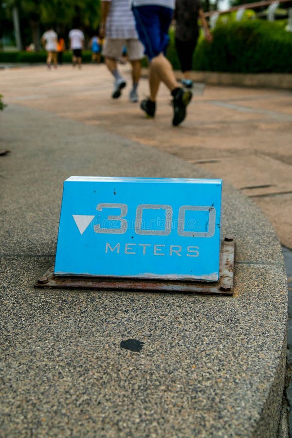 300 Meters Blue Running Sign Stock Image - Image of white, surface ...