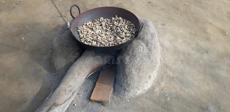 A Unique Method of Roasting Peanuts on an Earthen Stove in India Stock ...