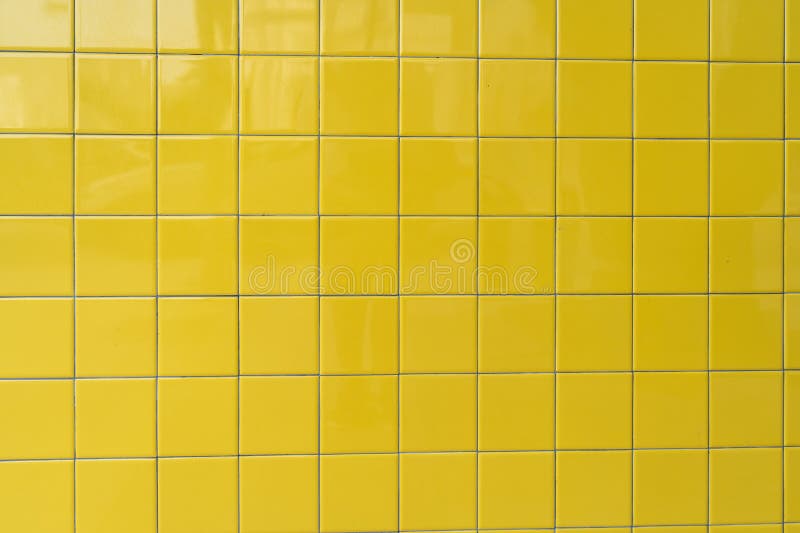 Meticulously Arranged Wall Adorned with Bright Yellow Tiles. Material ...