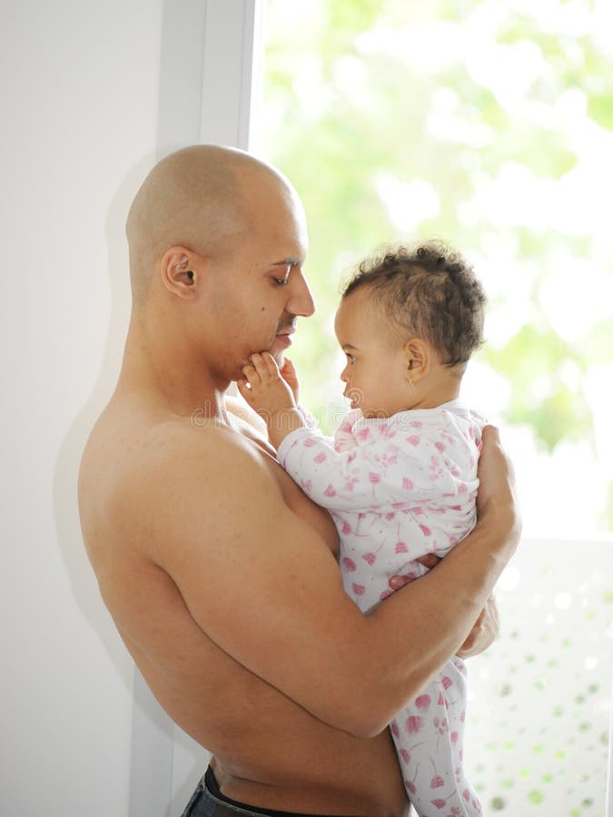 Metis Young Man and His Daughter Stock Photo - Image of room, young ...