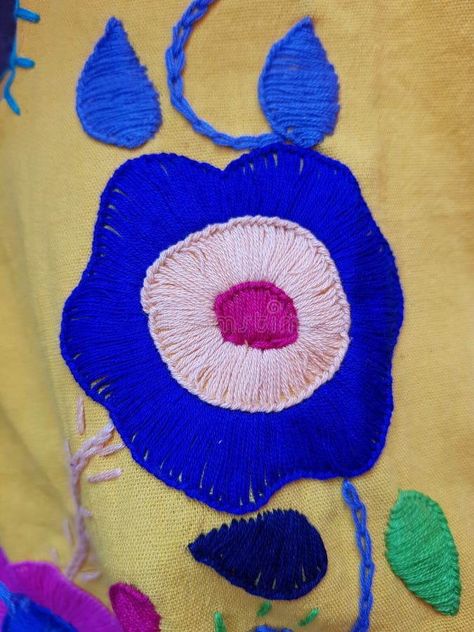 Flower Figure Embroidered with Color Threads on Yellow Fabric Stock ...