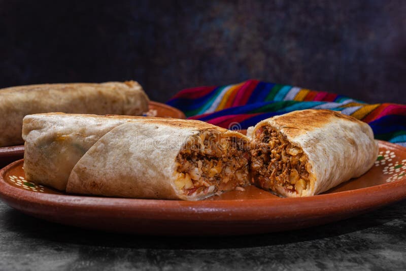 Mexican Burrito Cut on a Clay Plate. Stock Photo - Image of fast ...