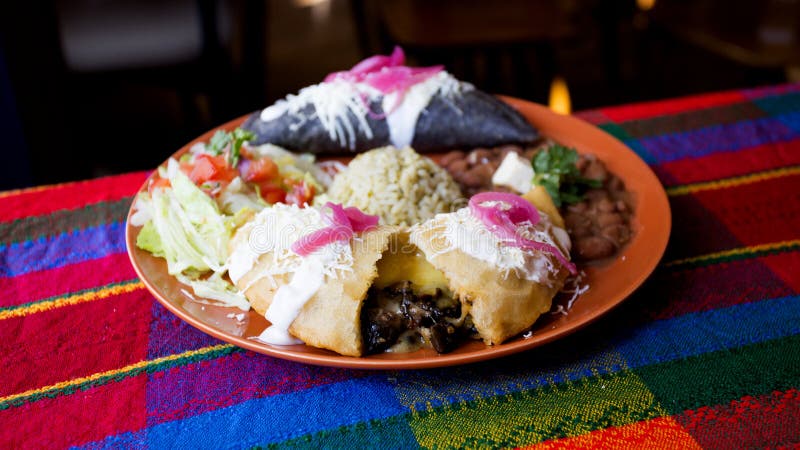 Mexican Combo Plate with Stuffed Corn Empanadas Stock Photo - Image of ...