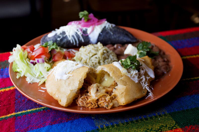 Mexican Combo Plate with Stuffed Corn Empanadas Stock Photo - Image of ...