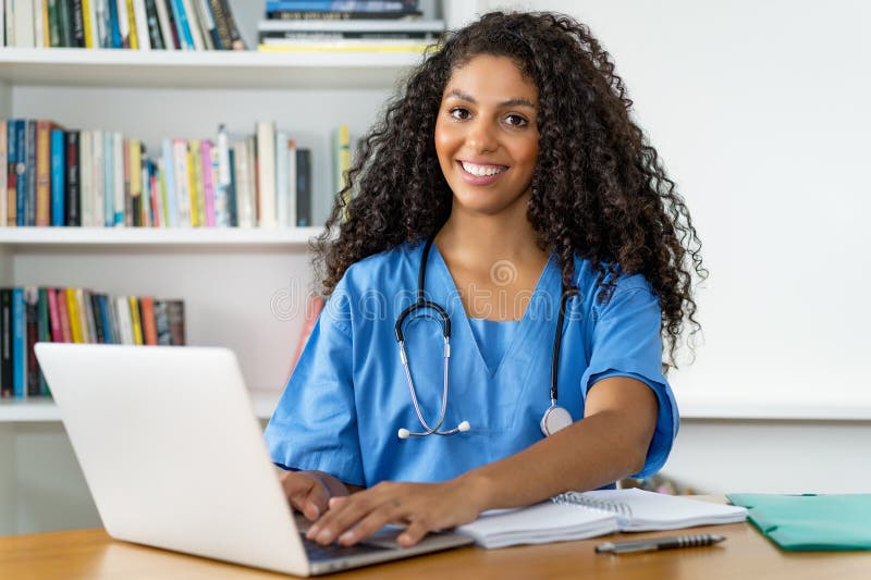 Mexican Female Nurse at Computer at Office Stock Image - Image of ...