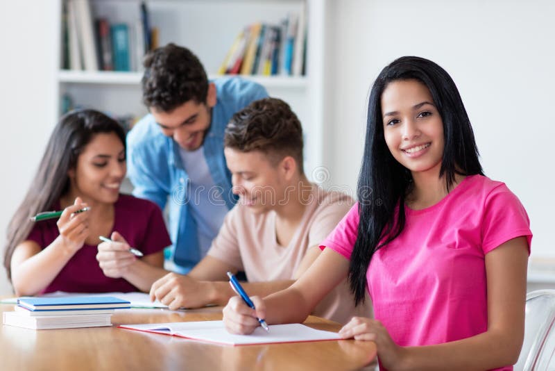 Mexican Female Student Learning with Group of Students Stock Image ...