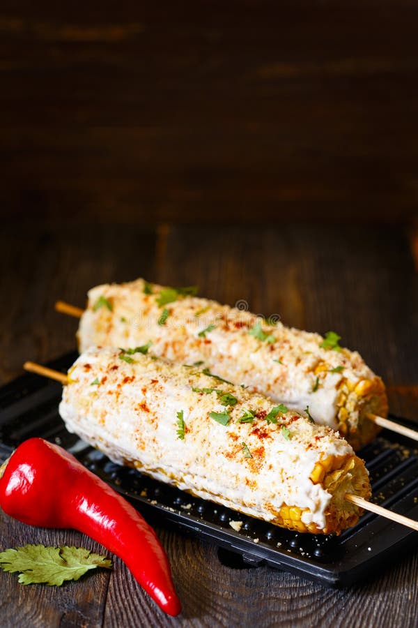 Mexican grilled corn. stock photo. Image of eating, cheese - 76801080