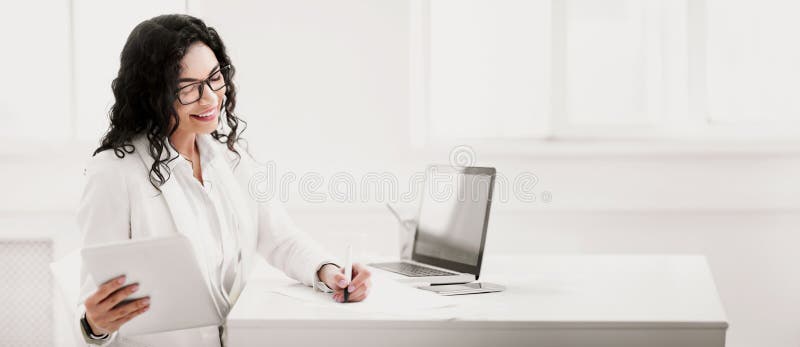 Mexican Manager Taking Notes from Tablet at Work Stock Photo - Image of ...