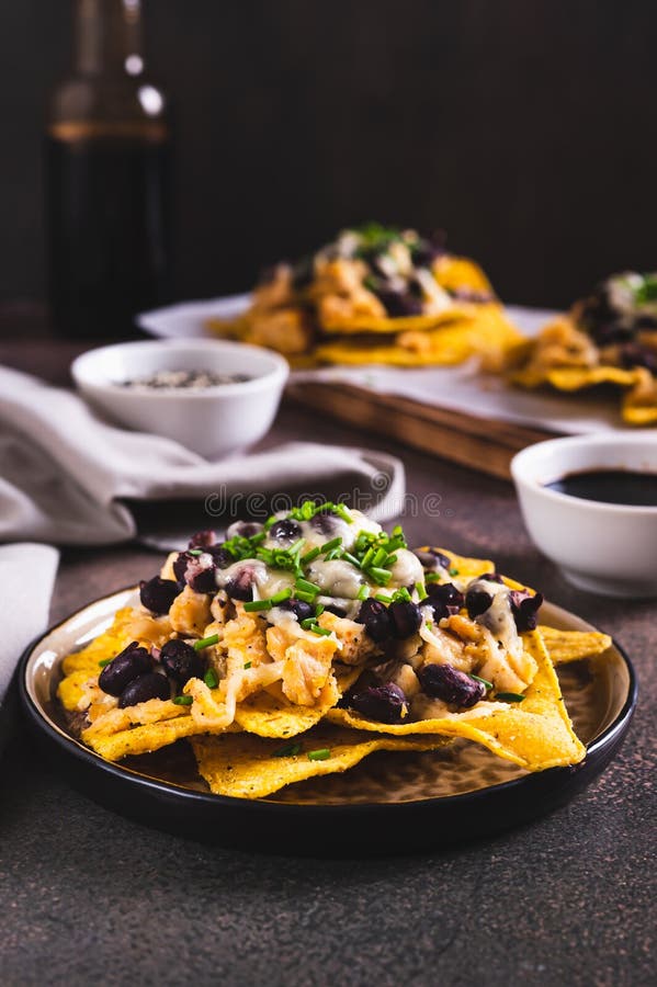 Mexican Nacho Chips Baked with Chicken, Black Beans and Cheese on a ...