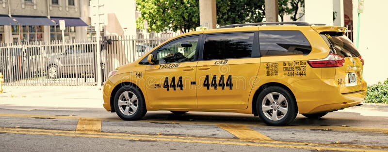 Miami Beach, Florida USA - April 14, 2021: Toyota Yellow Cab Taxi Car ... Miami Beach, Florida USA - April 14, 2021: Toyota Yellow Cab Taxi Car ...