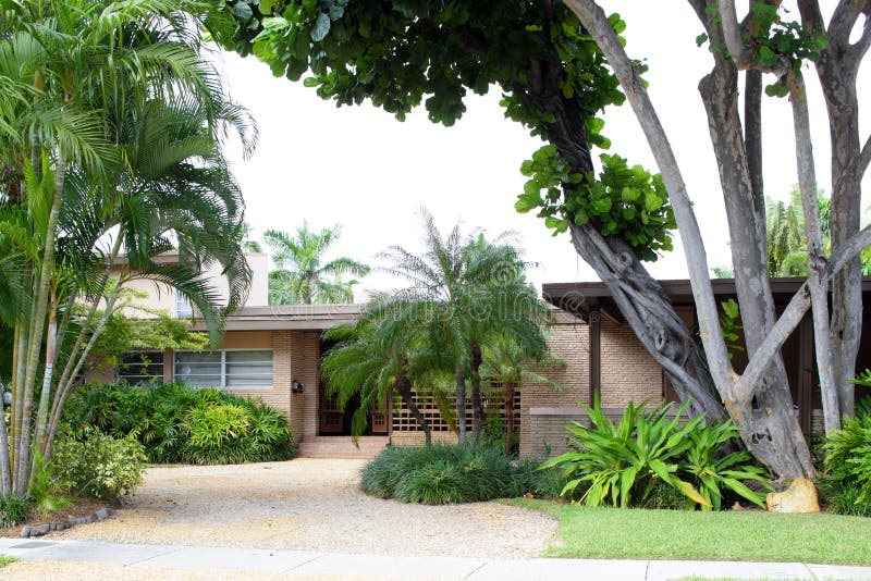 Miami Beach House with Drive Way Stock Photo - Image of bushes ...