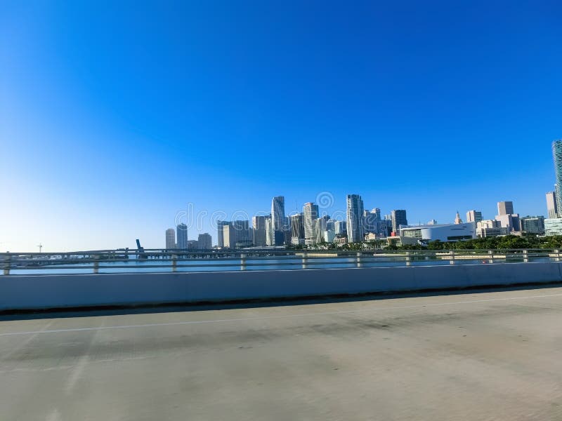 Miami Skyscrapers with Bridge Over Sea in the Day. Stock Photo - Image ...