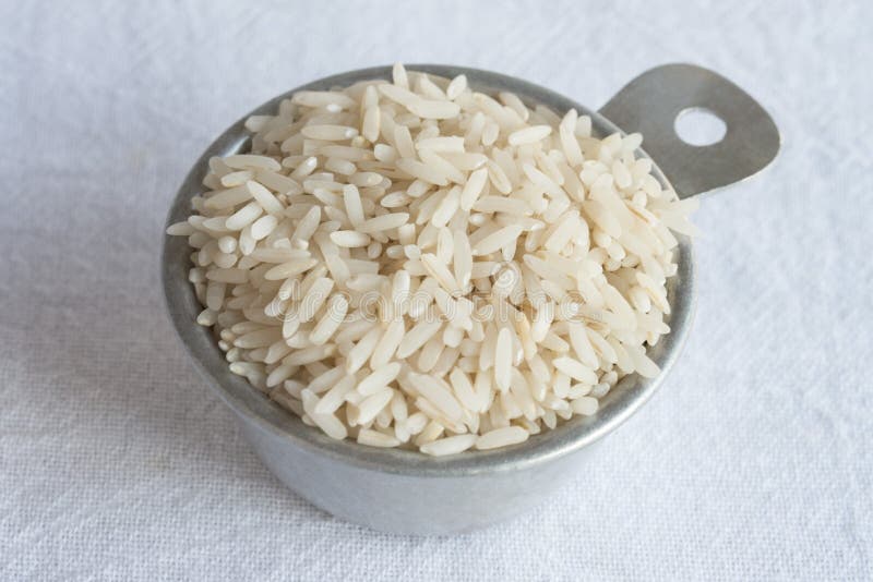 Uncooked White Rice in a Measuring Cup Stock Image - Image of macro ...