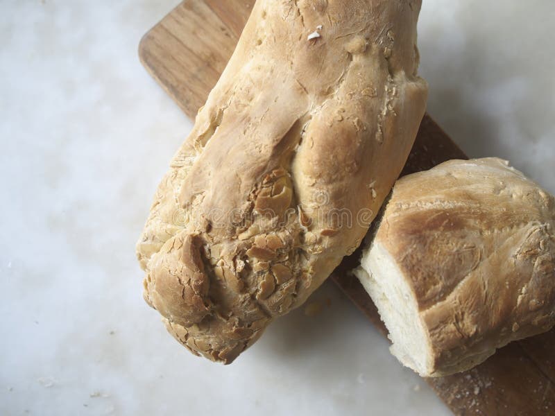 Michetta from Cremona, Partially Sliced on Cutting Board, Lying on ...