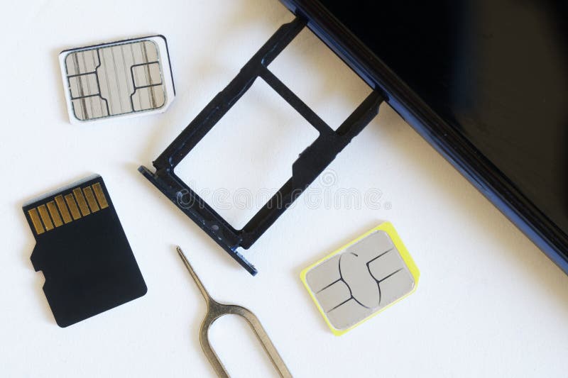 Micro Cd Card, Two Miniature Nano Sim Cards and a Smartphone with the ...
