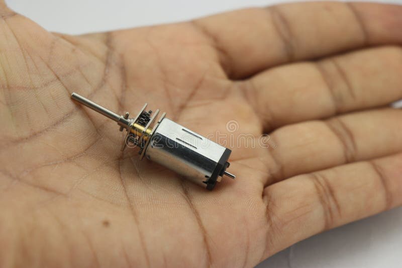 Micro Metal Gear Box Dc Motor Held in the Hand. Mini Dc Motor with ...