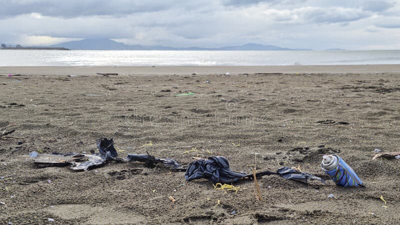 Micro Plastics Debris and Used Spray Cans Pollution on Sea Coast ...