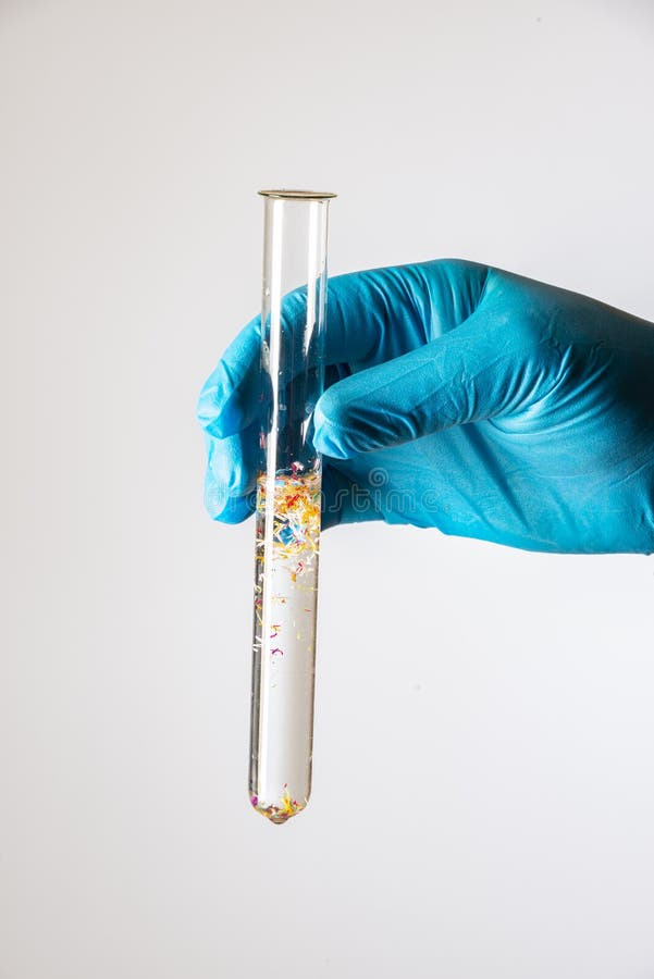Micro Plastics in a Test Tube with Drinking Water Stock Photo - Image ...