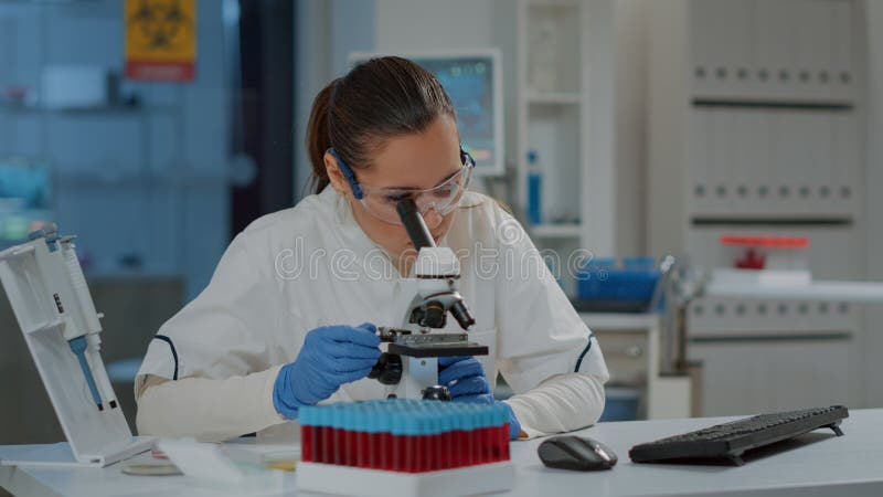 Microbiologist Working with Microscopic Tool To Research Substance ...