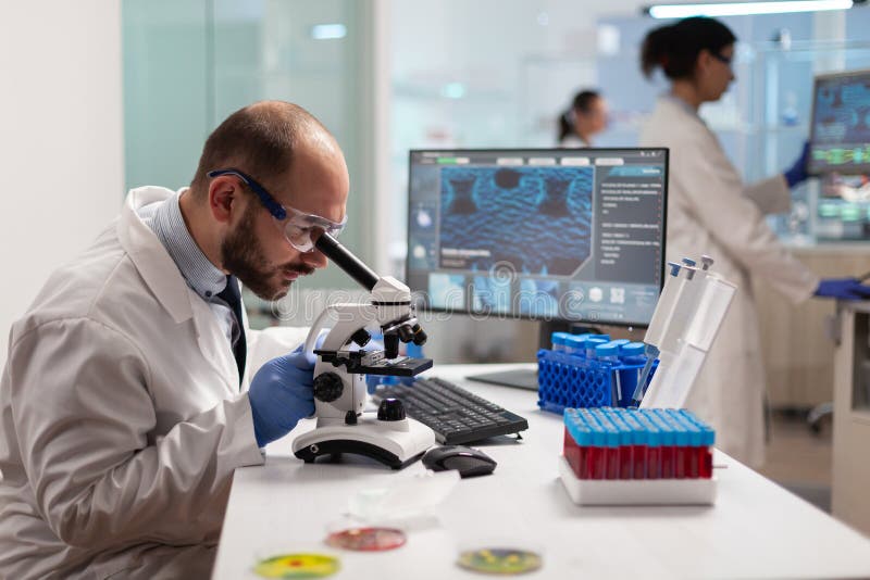Microbiologist Working To Find a Vaccine for Virus in Lab Stock Photo ...