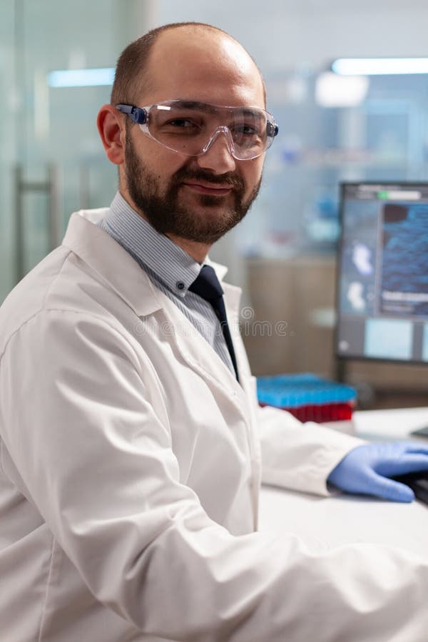 Microbiology Researcher Looking at Camera in Chemical Lab Stock Photo ...