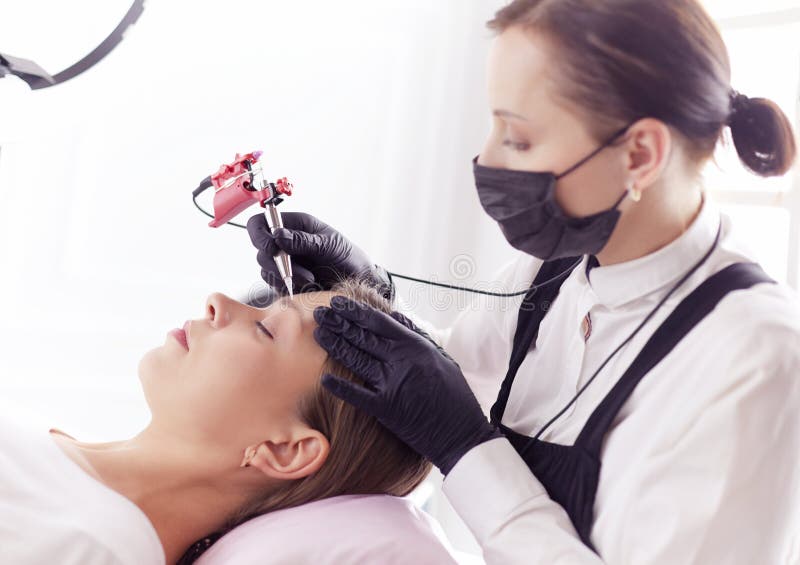 Microblading Eyebrows Work Flow in a Beauty Salon. Woman Having Her Eye ...