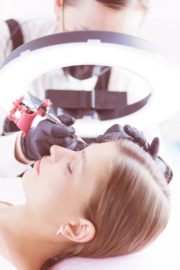 Microblading Eyebrows Work Flow in a Beauty Salon. Woman Having Her Eye ...