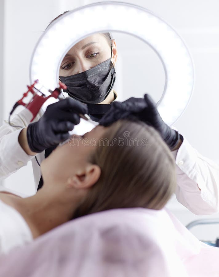 Microblading Eyebrows Work Flow in a Beauty Salon. Woman Having Her Eye ...