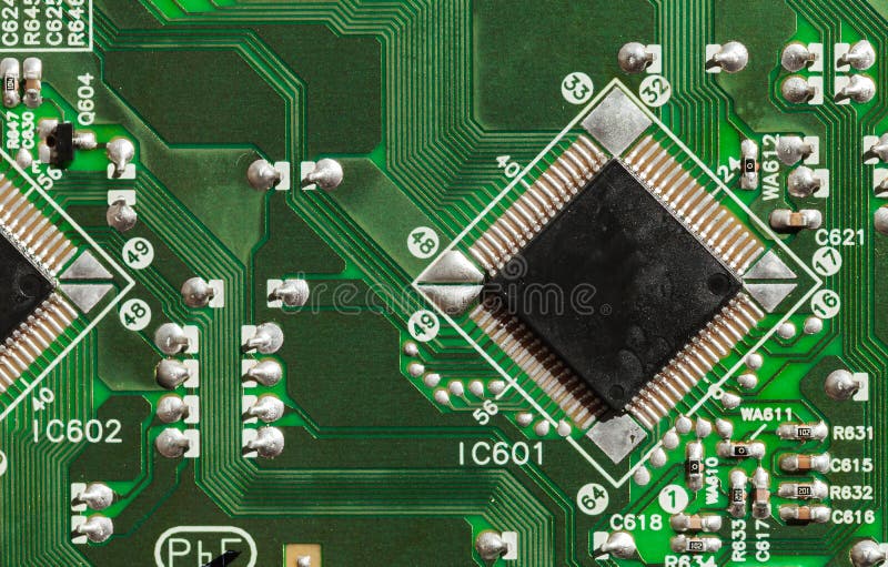 Microchip and Capacitors are on a Green Printed Circuit Top View Stock ...