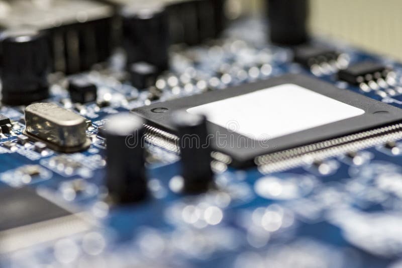 Microchips on a pc board stock image. Image of detail - 140500863