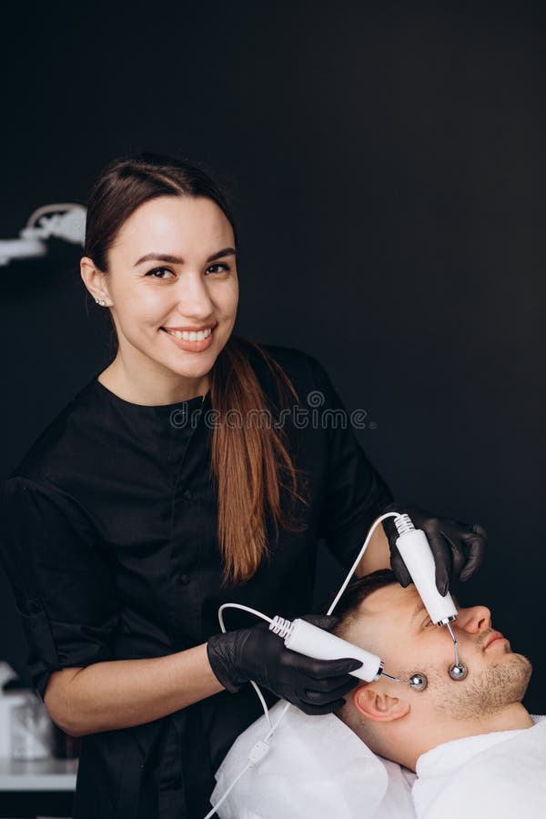 Microcurrent Therapy Close Up. Hands of Cosmetologist, Male Face. Stock ...