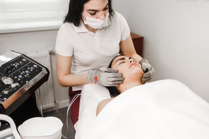 Microcurrent Therapy. Cosmelotologist Makes Stimulating Facial Massage ...