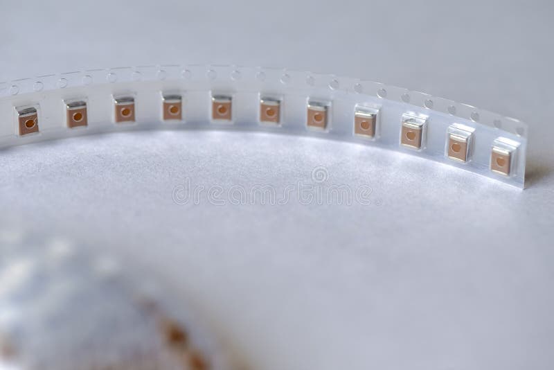 Microelectronic Industry Concepts. Closeup of Tape with SMD or Surface ...