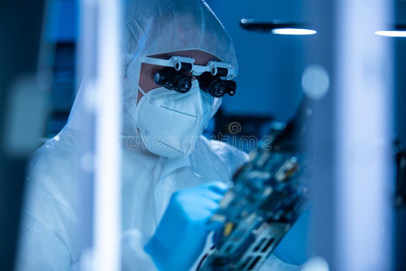 Microelectronics Engineer Works in a Modern Scientific Laboratory on ...