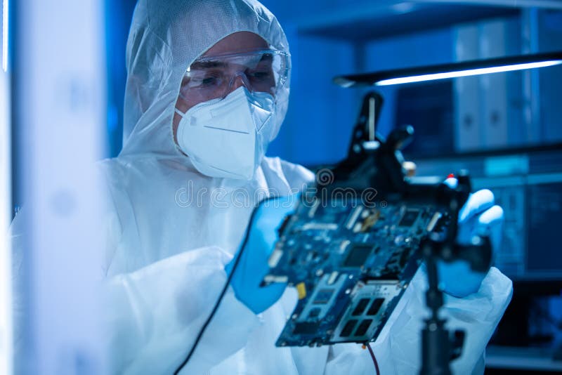 Microelectronics Engineer Works in a Modern Scientific Laboratory on ...