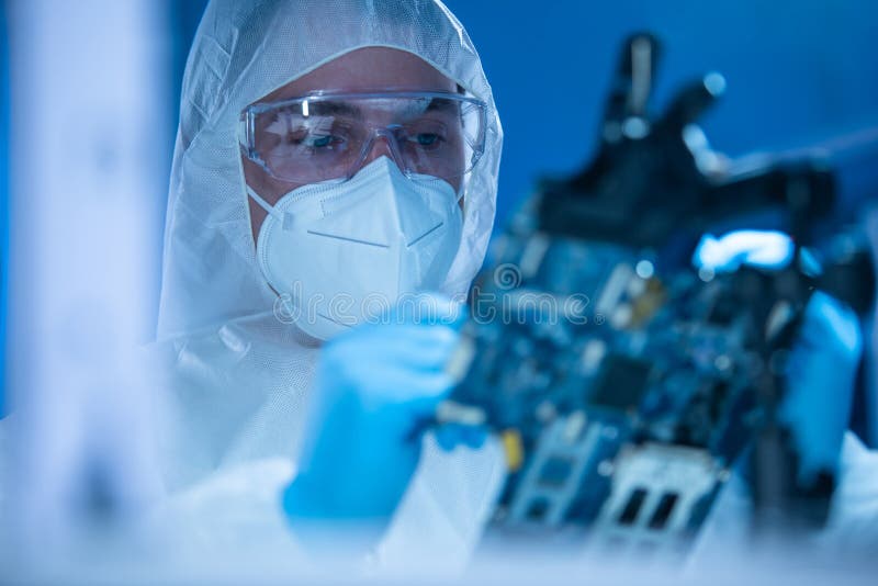 Microelectronics Engineer Works in a Modern Scientific Laboratory on ...