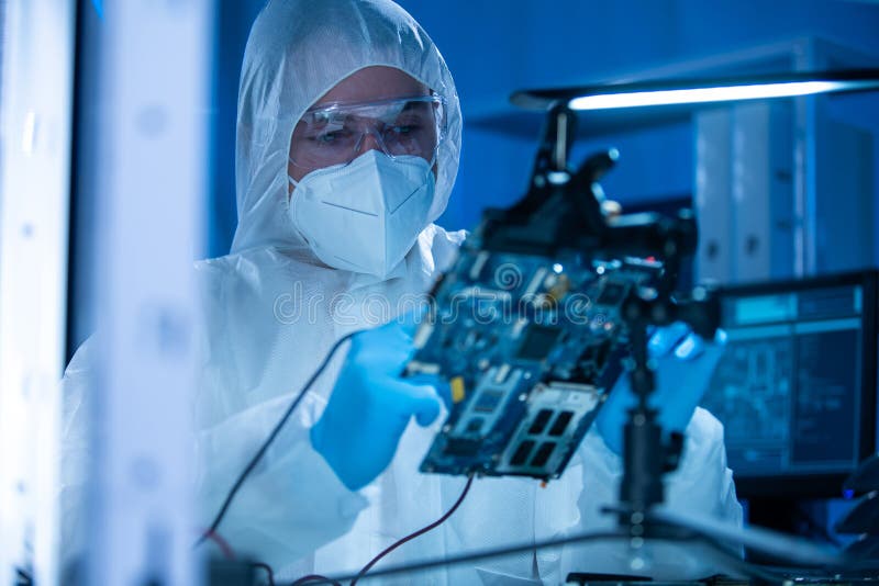 Microelectronics Engineer Works in a Modern Scientific Laboratory on ...