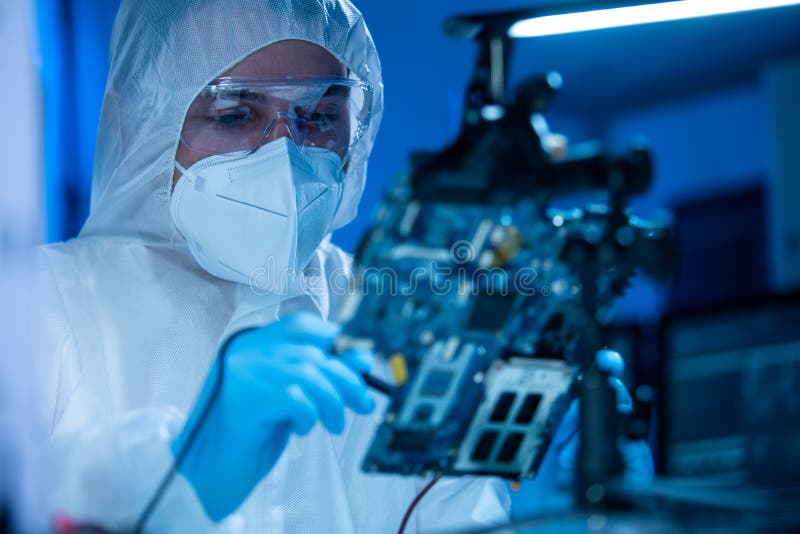 Microelectronics Engineer Works in a Modern Scientific Laboratory on ...