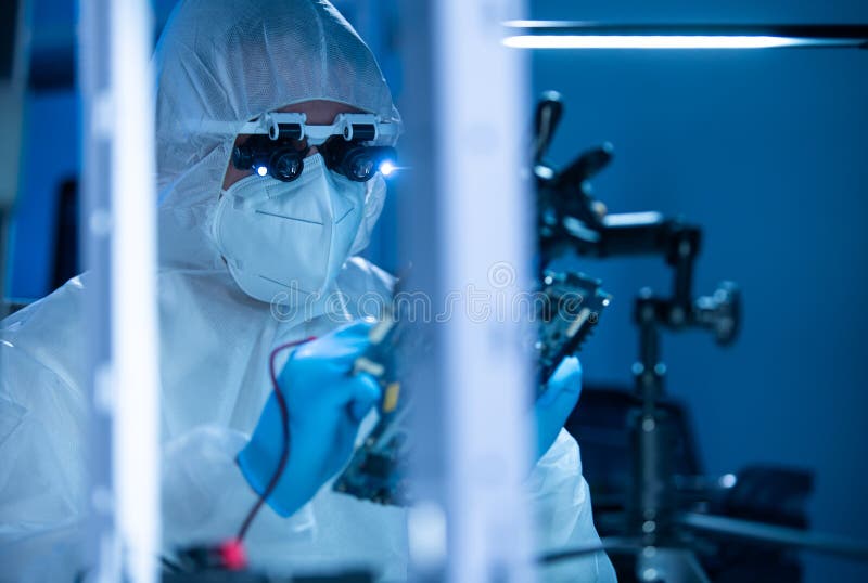 Microelectronics Engineer Works in a Modern Scientific Laboratory on ...