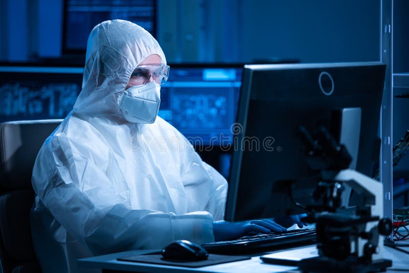 Microelectronics Engineer Works in a Modern Scientific Laboratory on ...