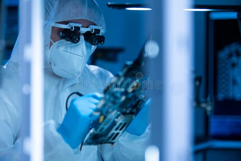 Microelectronics Engineer Works in a Modern Scientific Laboratory on ...