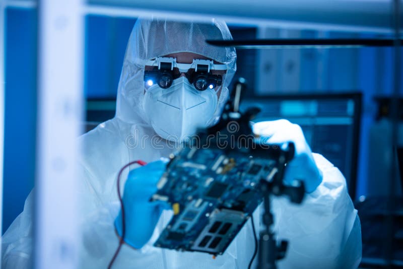 Microelectronics Engineer Works in a Modern Scientific Laboratory on ...