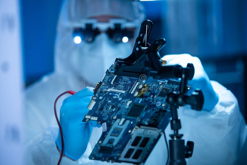 Microelectronics Engineer Works in a Modern Scientific Laboratory on ...