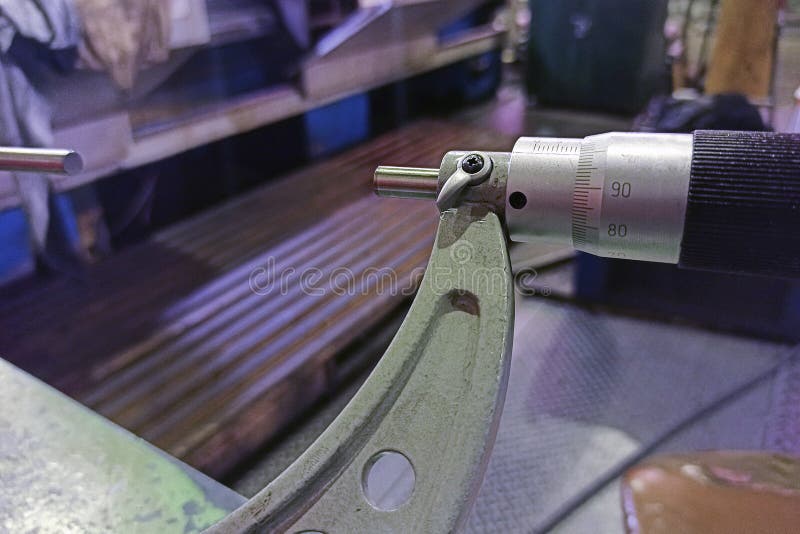 Micrometer Close-up on the Background of Machine Tools. the Concept of ...