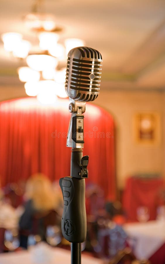Microphone and Wooden Stool on a Stand Up Comedy Stage with Reflectors ...