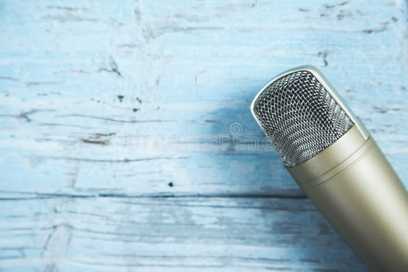 Microphone on Blue Background Stock Photo - Image of studio, volume ...