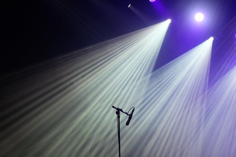 Microphone and Bright Rays of Light on Stage before the Concert Begins ...