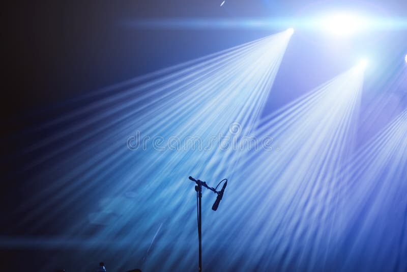 Microphone and Bright Rays of Light on Stage before the Concert Begins ...